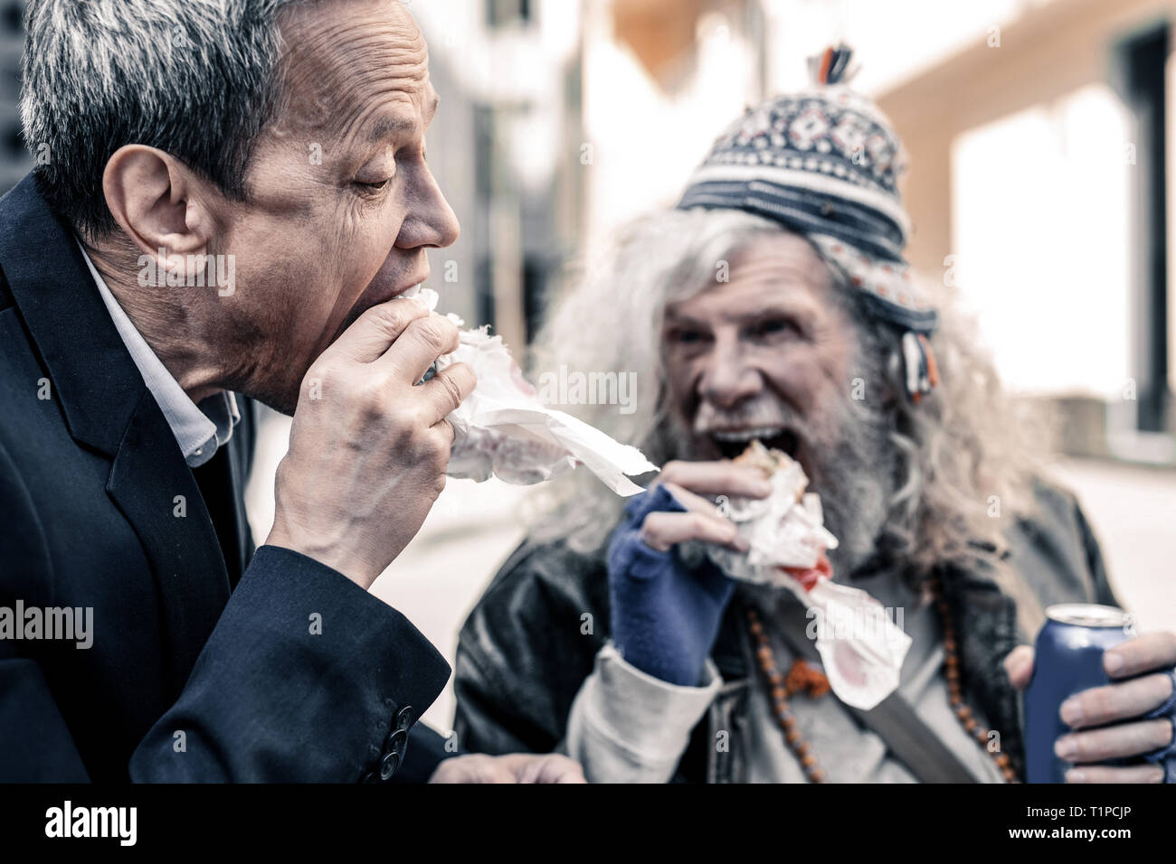 Man biting sandwich hi-res stock photography and images - Alamy