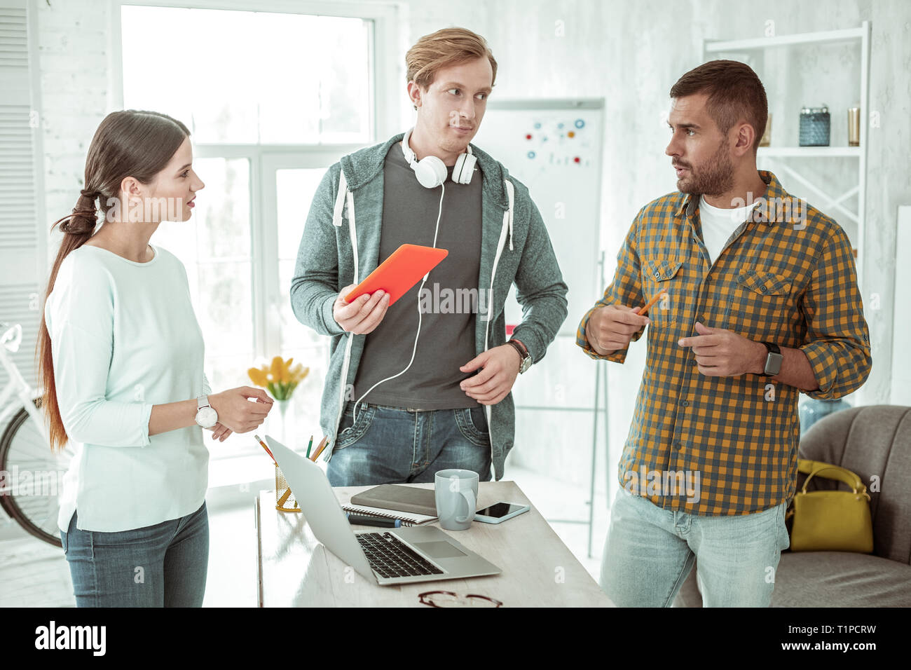 Smart intelligent man speaking with his friends Stock Photo - Alamy
