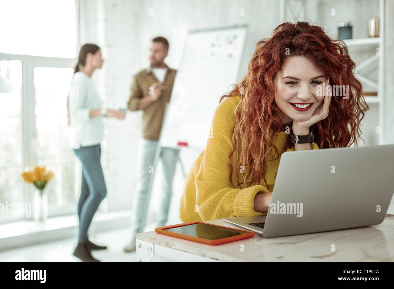 Smart good looking woman working on the laptop Stock Photo - Alamy