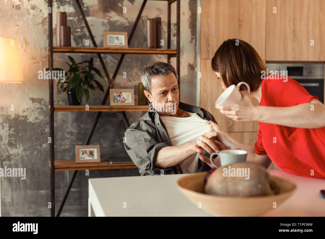 Serious adult man asking his mad wife calm and serenity Stock Photo - Alamy