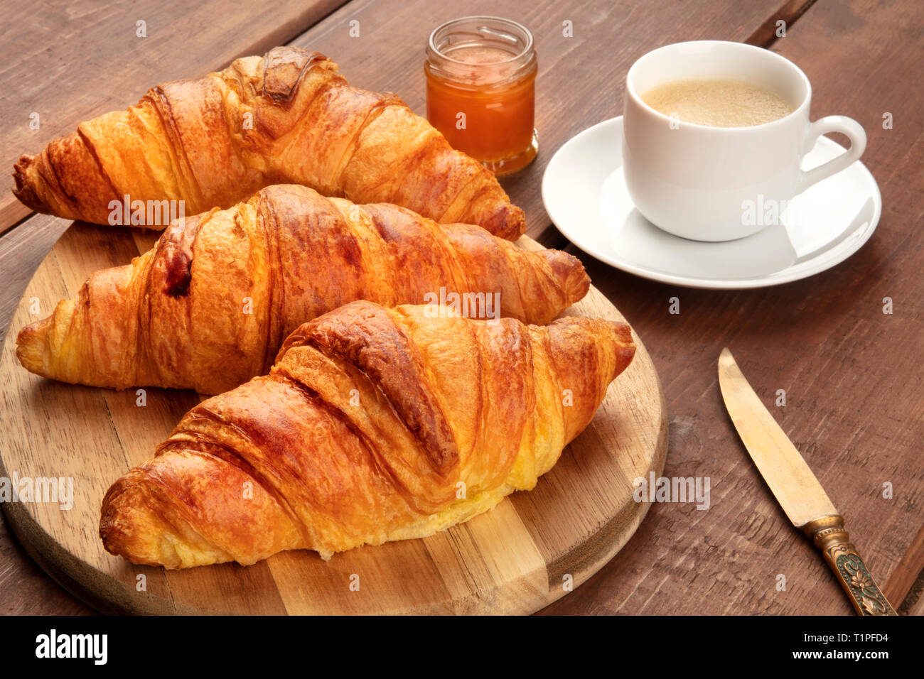 A closeup photo of a breakfast with croissants, coffee, and jam Stock ...