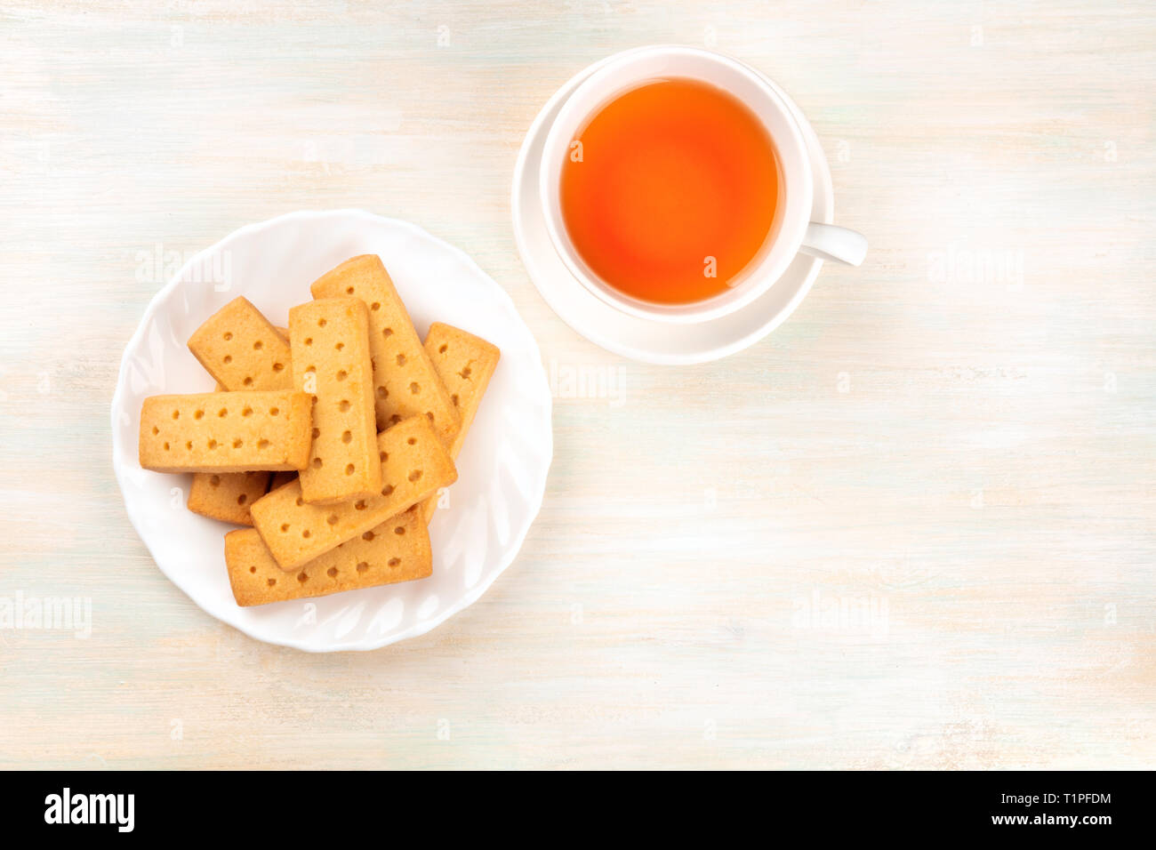 Scottish shortbread butter cookies, shot from the top on a white wooden ...