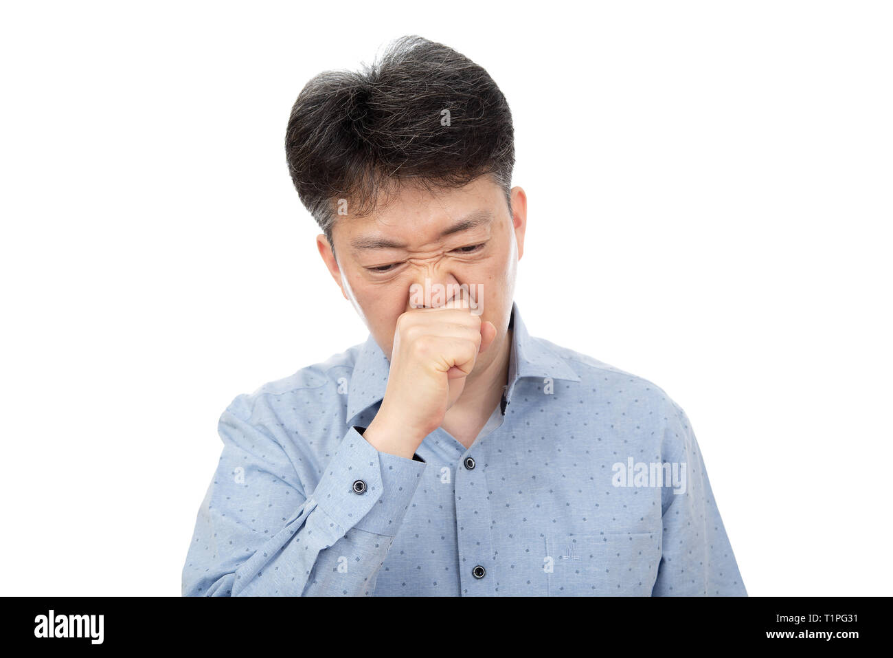 A middle-aged man suffering from rhinitis on white background Stock ...