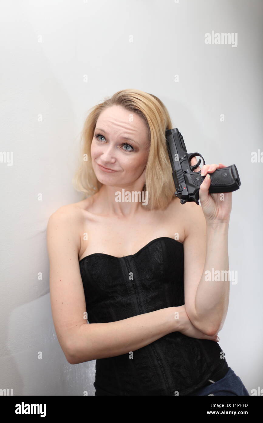 Girl with gun Stock Photo - Alamy