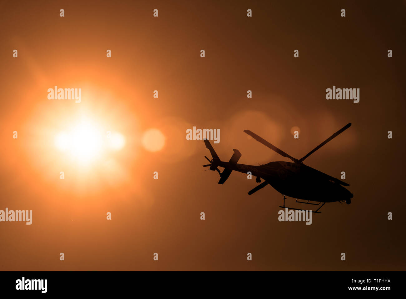 Helicopter silhouette sun flying hi-res stock photography and images ...