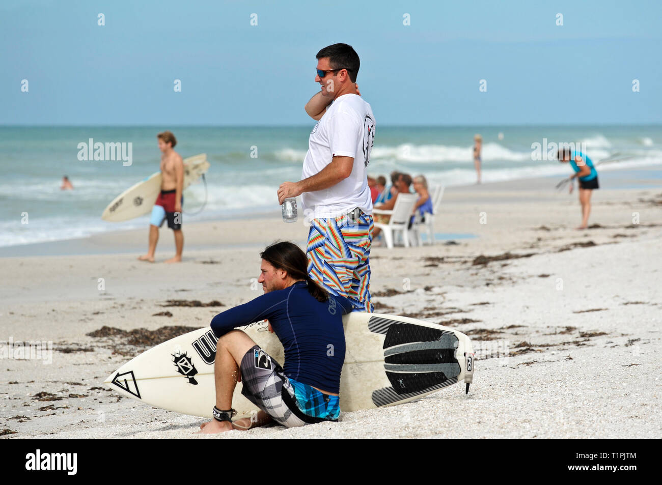 HOLMES BEACH, ANNA MARIA ISLAND, FL / USA - October 4, 2013: Surfers on ...
