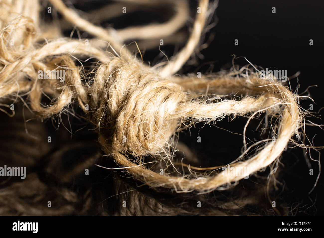 Jute rope on black glass Stock Photo - Alamy