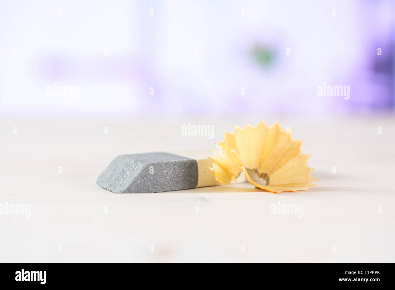 Yellow pencil fan-shaped shaving with an eraser with blue window in ...