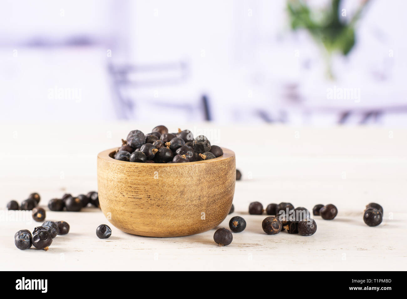 Lot of whole dry juniper berry seed with red flowers on white in ...