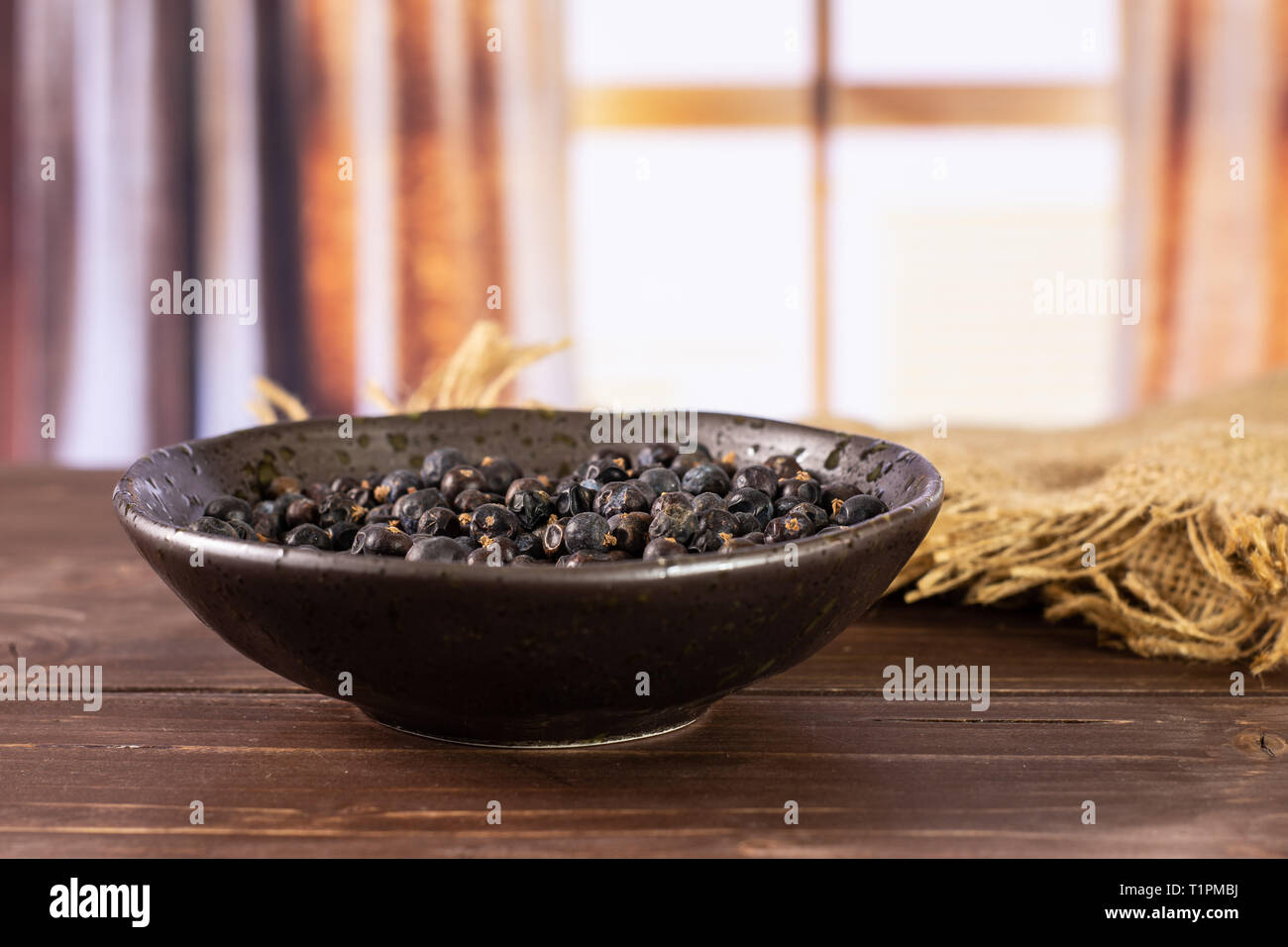 Lot of whole dry juniper berry seed with silk curtains behind Stock ...