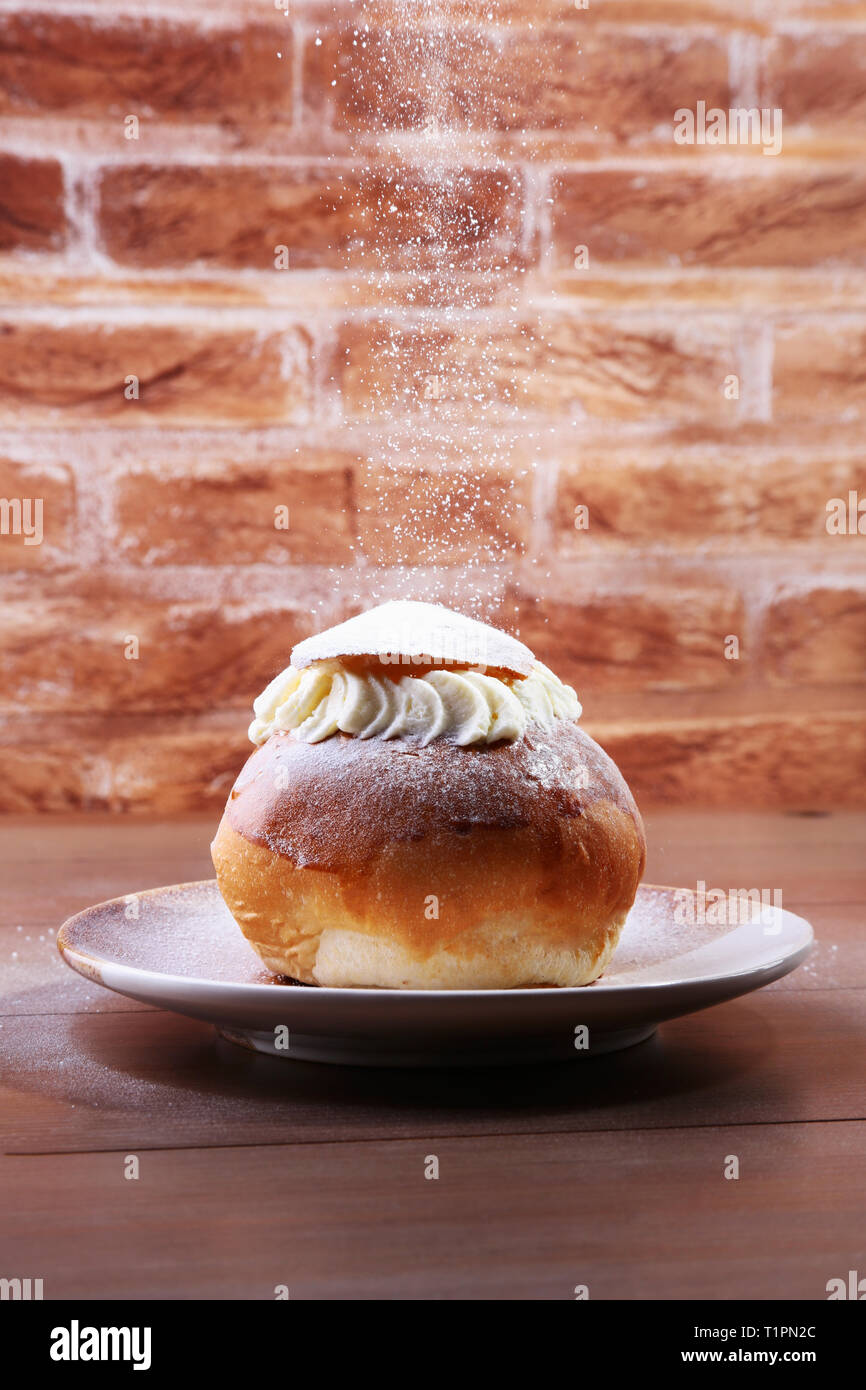 Traditional swedish dessert Semla, also called Shrove bun, with almond ...