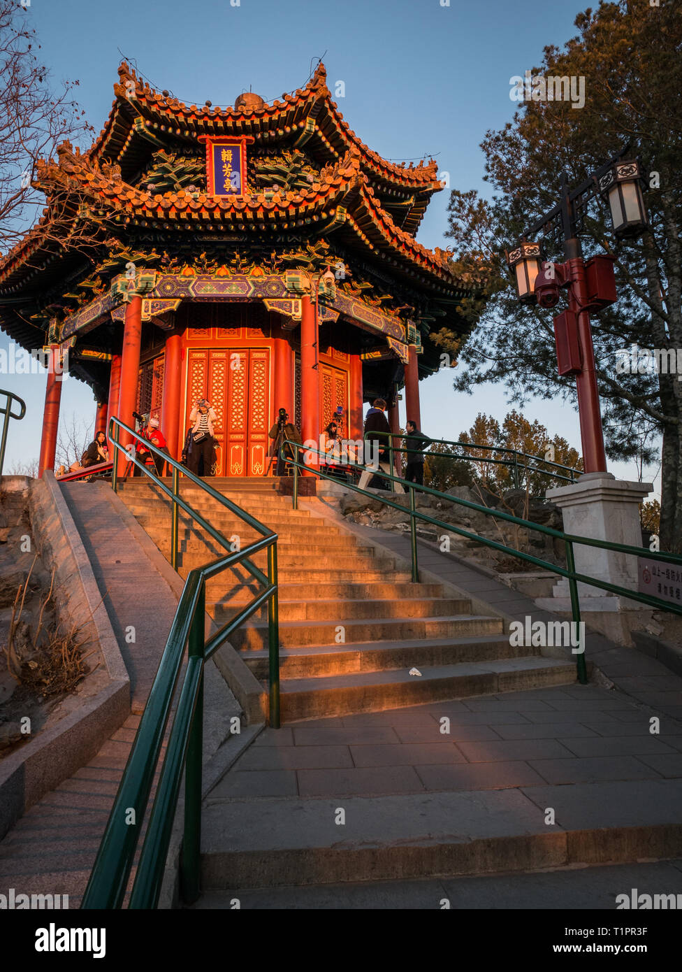 Classical red Chinese pavilion with colorful ornaments and stairs in ...