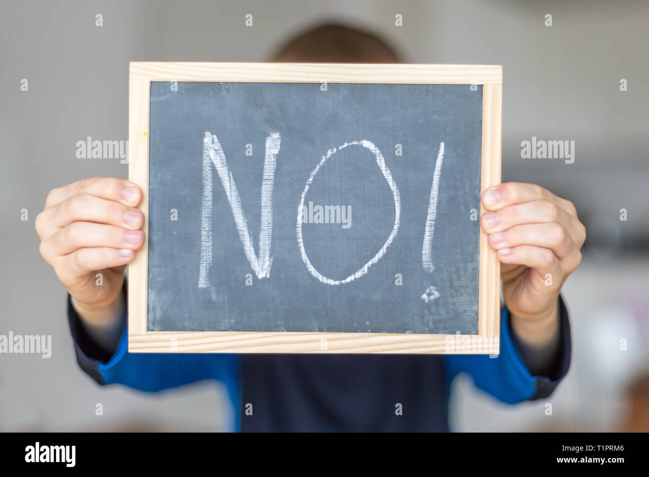 boy holds chalkboard Stock Photo - Alamy