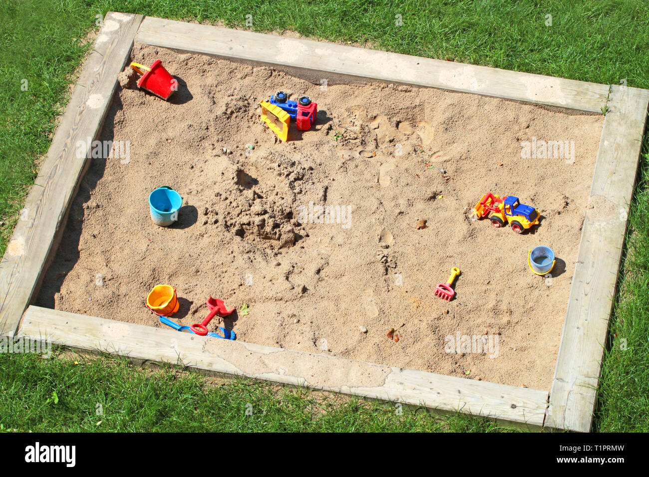 sandbox with plastic toys Stock Photo - Alamy