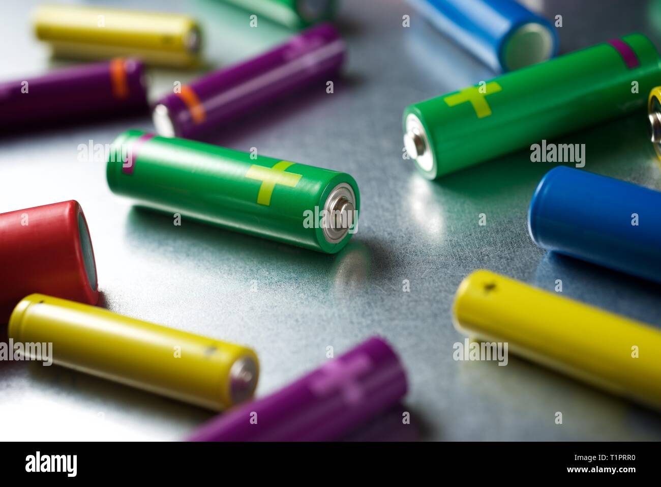 Many batteries on a metal table Stock Photo - Alamy