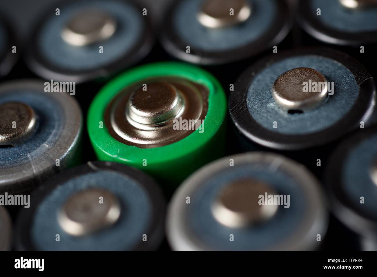 Many batteries on a metal table Stock Photo - Alamy