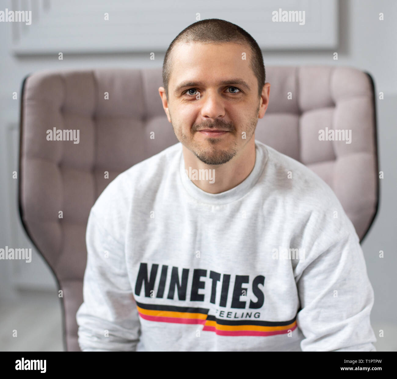 Portrait of casual man looking in camera Stock Photo - Alamy