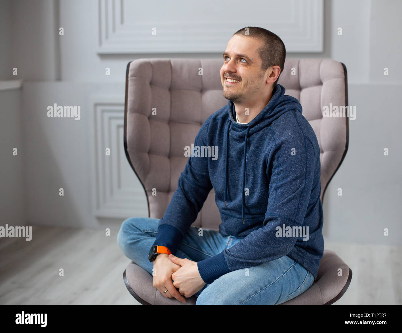Smiling man looking on side and smiling Stock Photo - Alamy