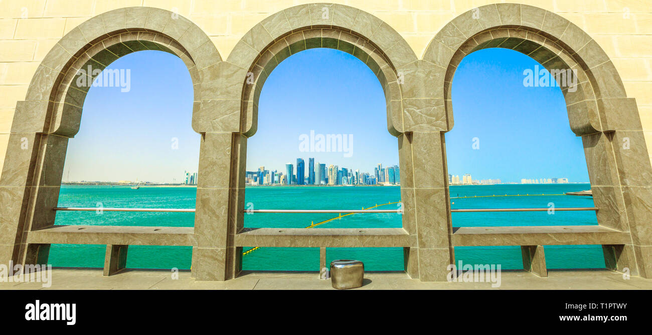 Panorama of Doha West Bay skyline through arched windows opening view ...