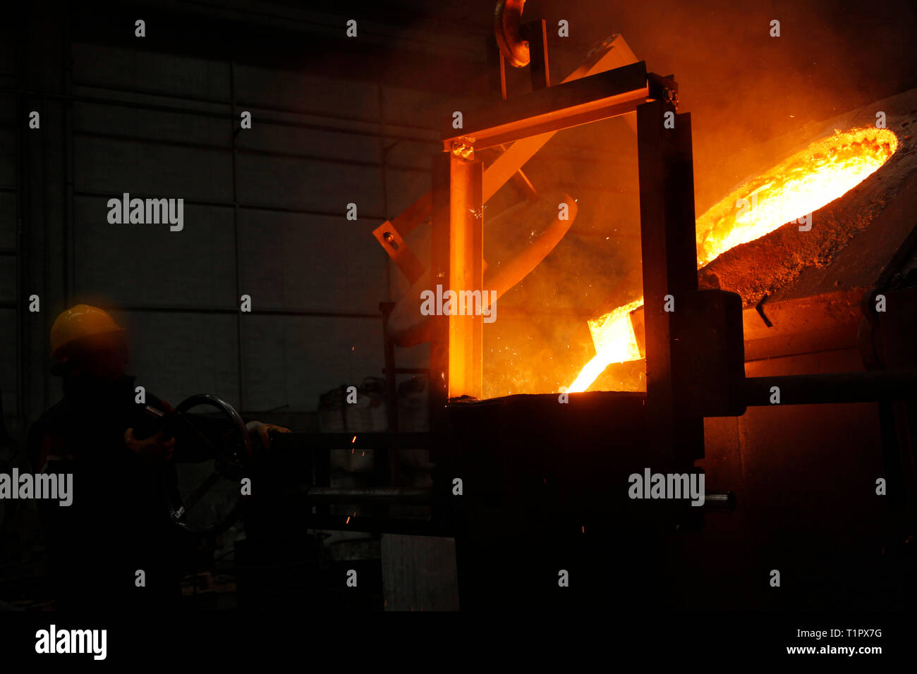 casting factory and worker Stock Photo - Alamy