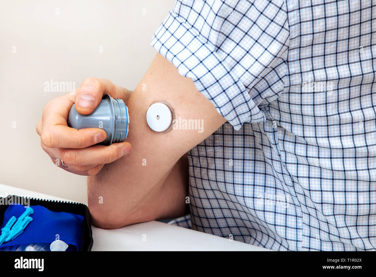 Man testing glucose level with a digital glucometer, sensor checkup ...