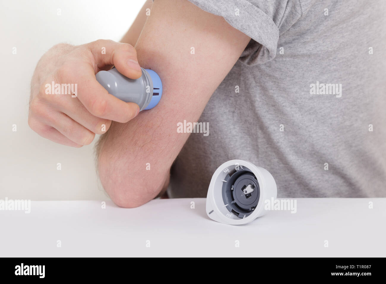 Man testing glucose level with a digital glucometer, sensor checkup ...