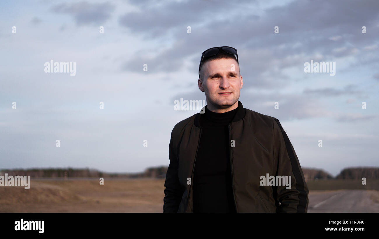 Outdoor portrait of young handsome smiling man - nature background ...