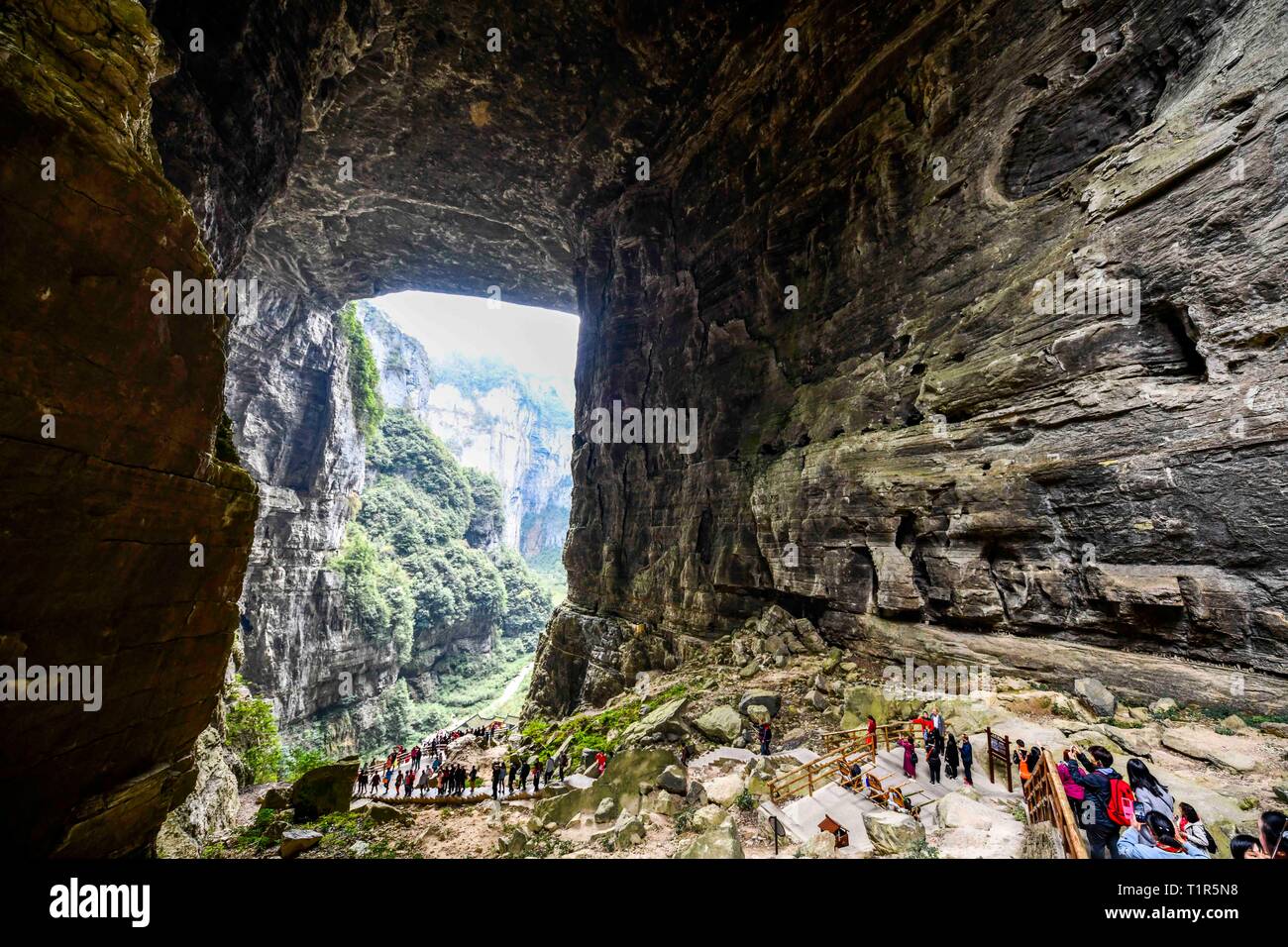 Chongqing, China. 27th Mar, 2019. Tourists go sightseeing at the ...