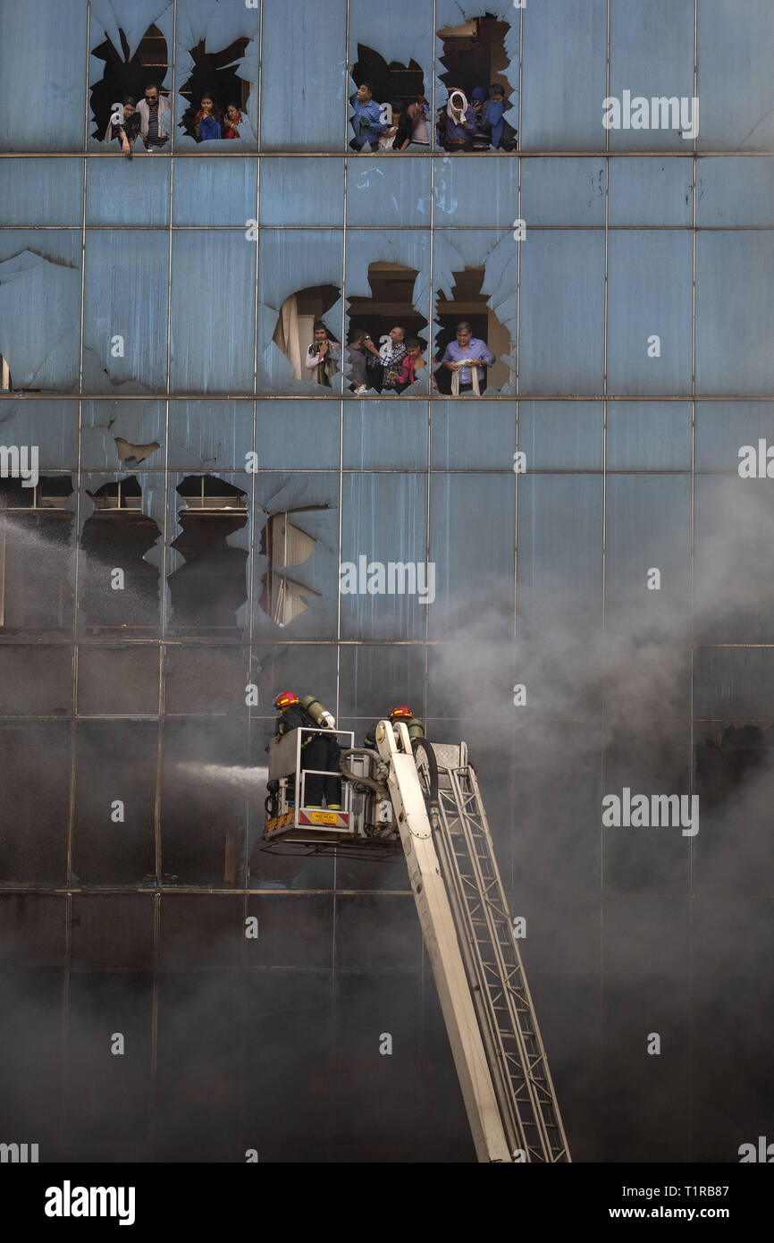 Dhaka, Bangladesh. 28th Mar, 2019. Bangladeshi firefighter works on ...