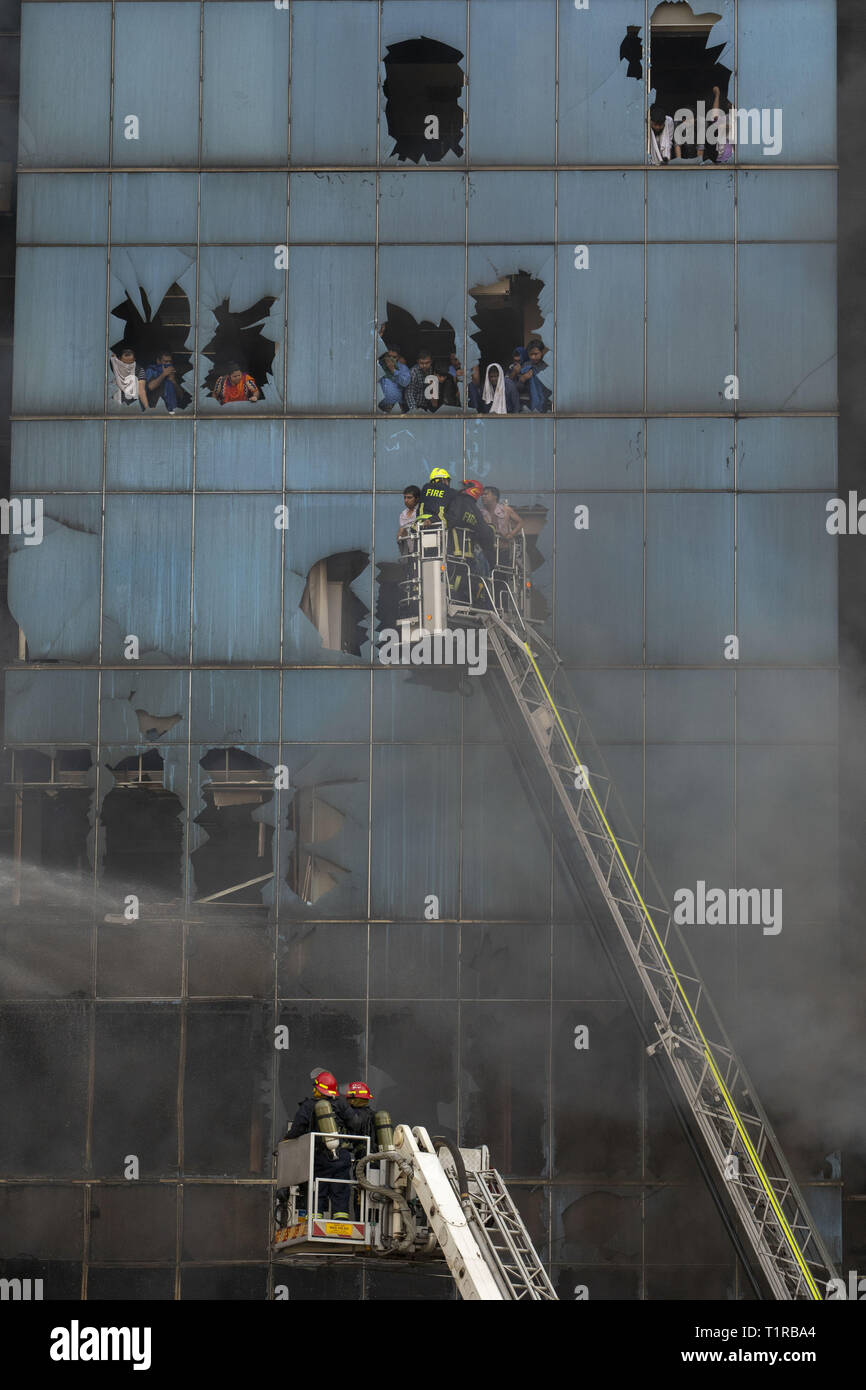 Dhaka, Bangladesh. 28th Mar, 2019. Bangladeshi firefighter works on ...