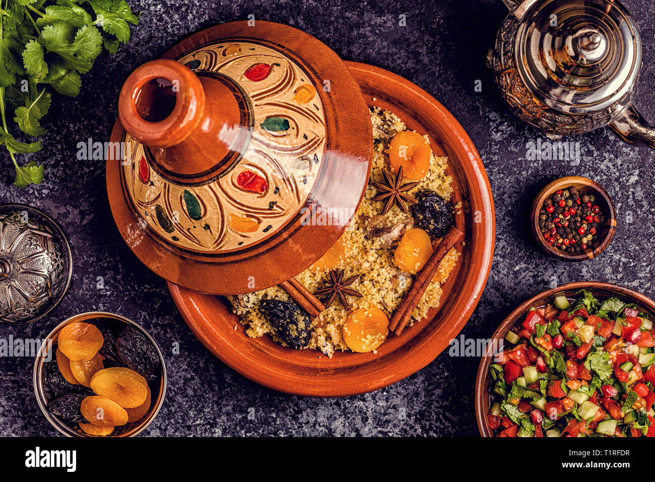 Traditional moroccan tajine of chicken with dried fruits and spices ...