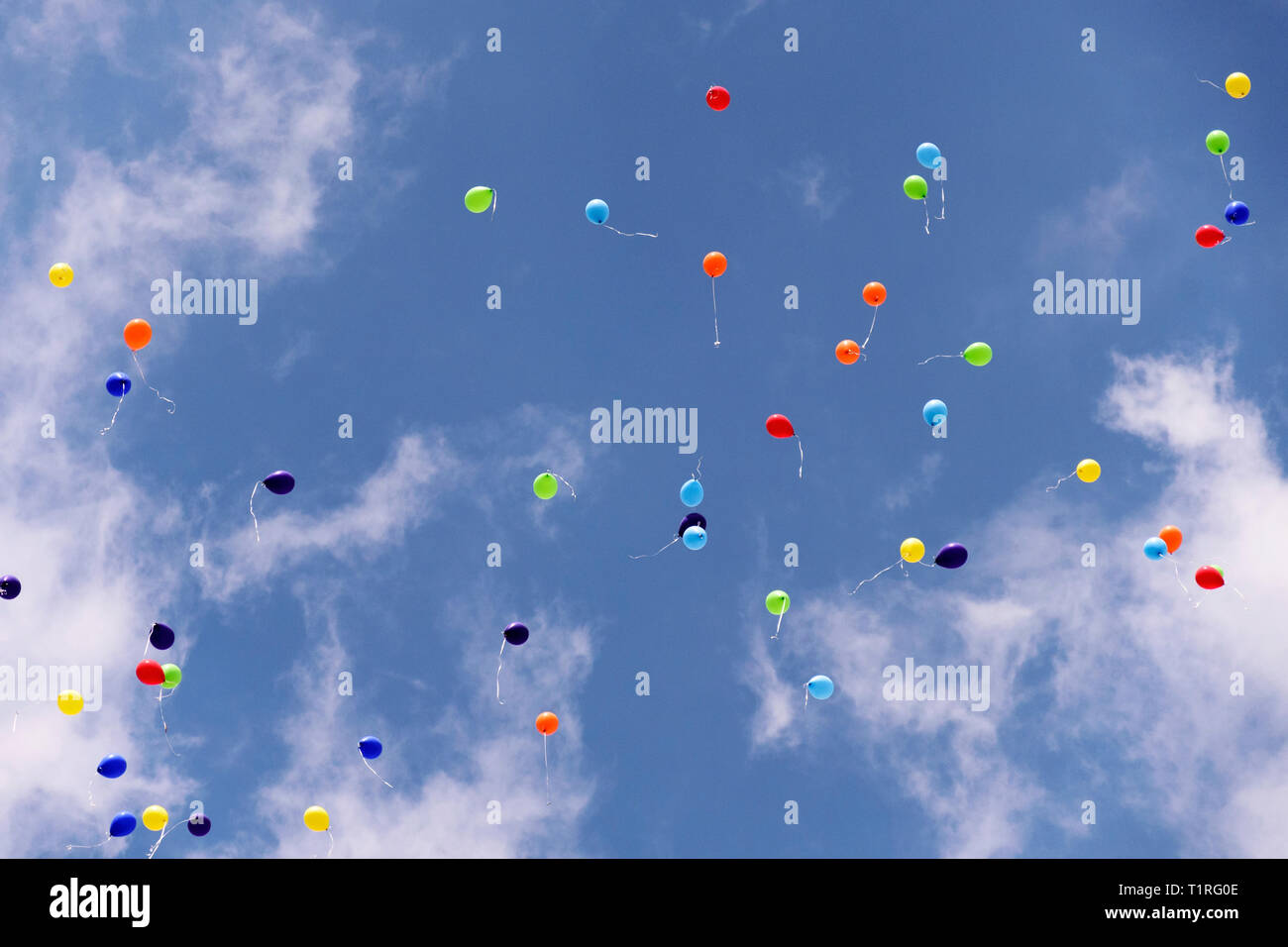 Balloons flying to the blue sky Stock Photo - Alamy
