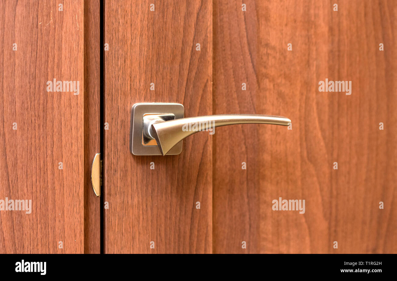 Closeup of metal doorhandle Stock Photo - Alamy