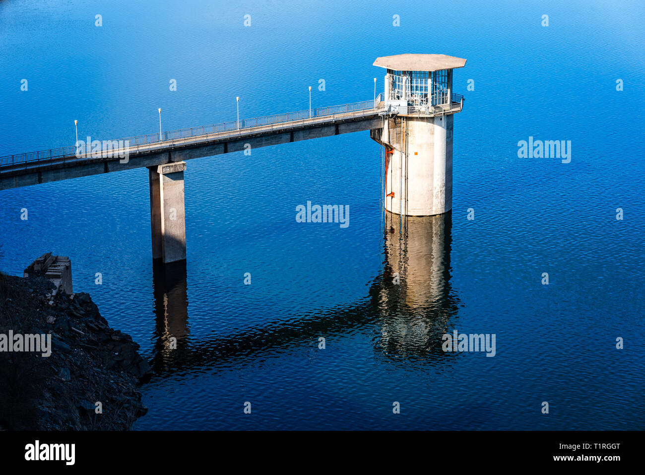 The Atazar reservoir and control tower of Dam in the mountain range of ...