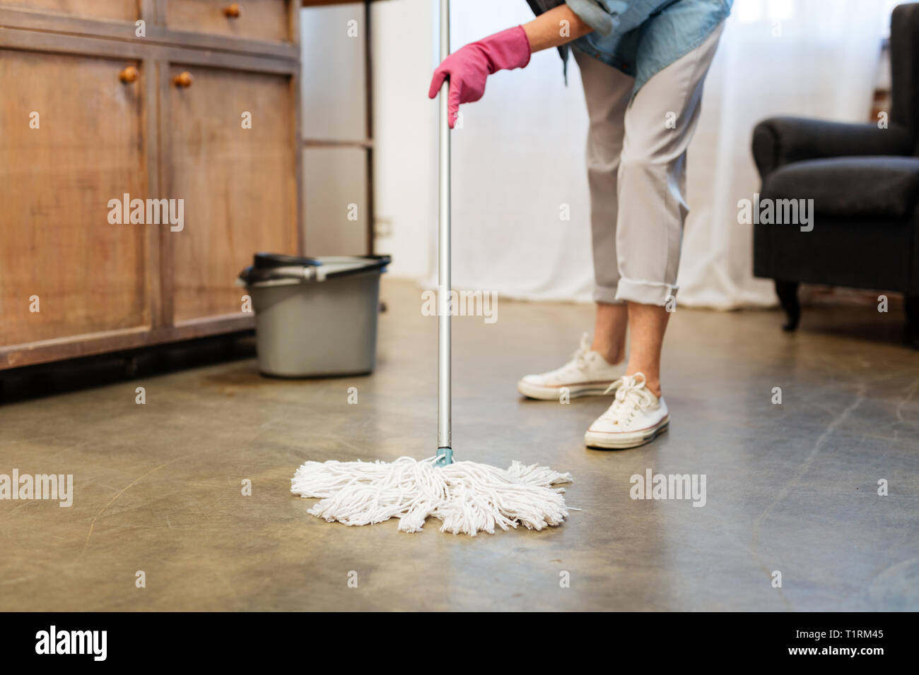 Adult female cleaner wearing rubber pink gloves Stock Photo - Alamy