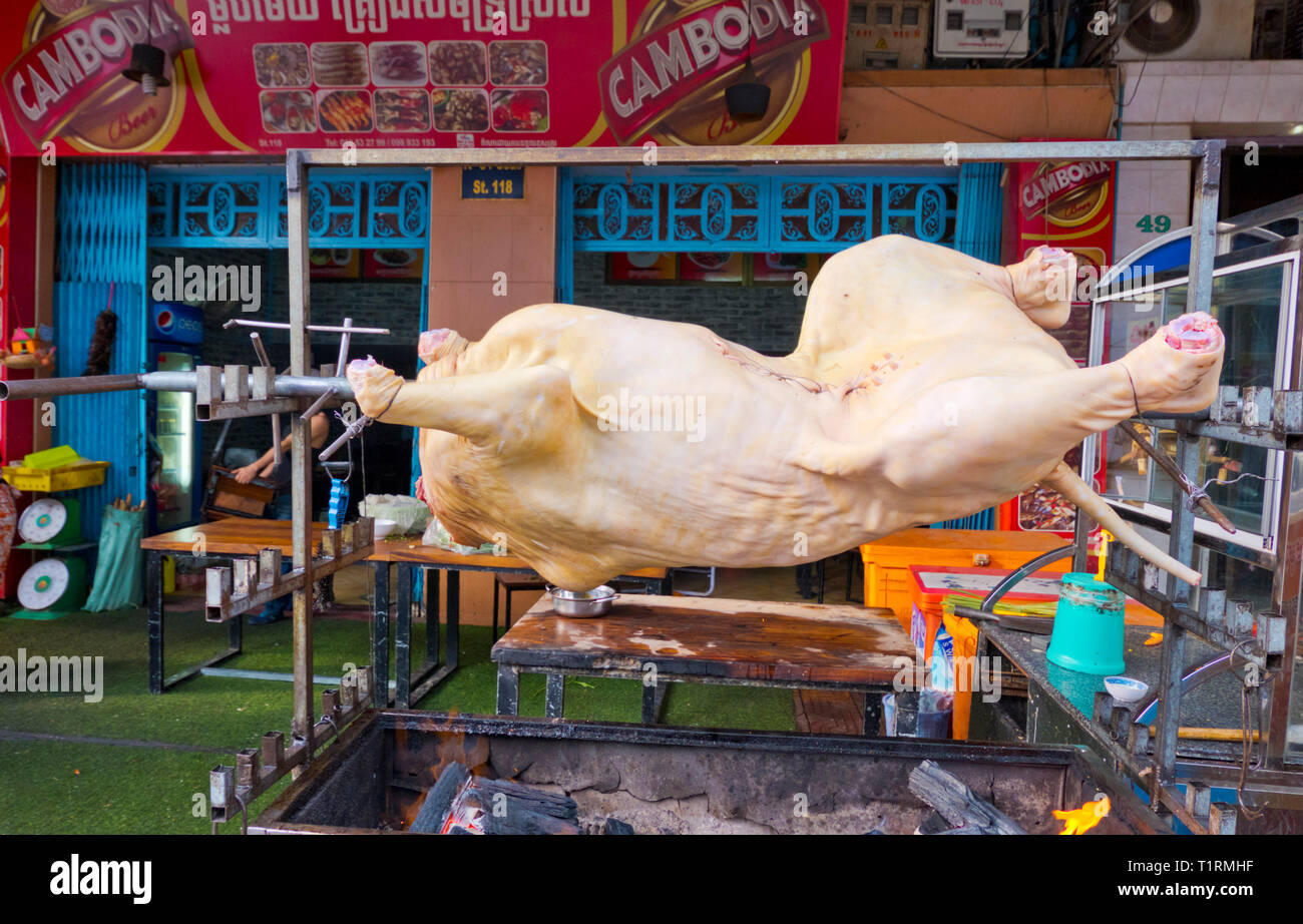 Whole cow being roasted, riverfront area, Phnom Penh, Cambodia, Asia ...