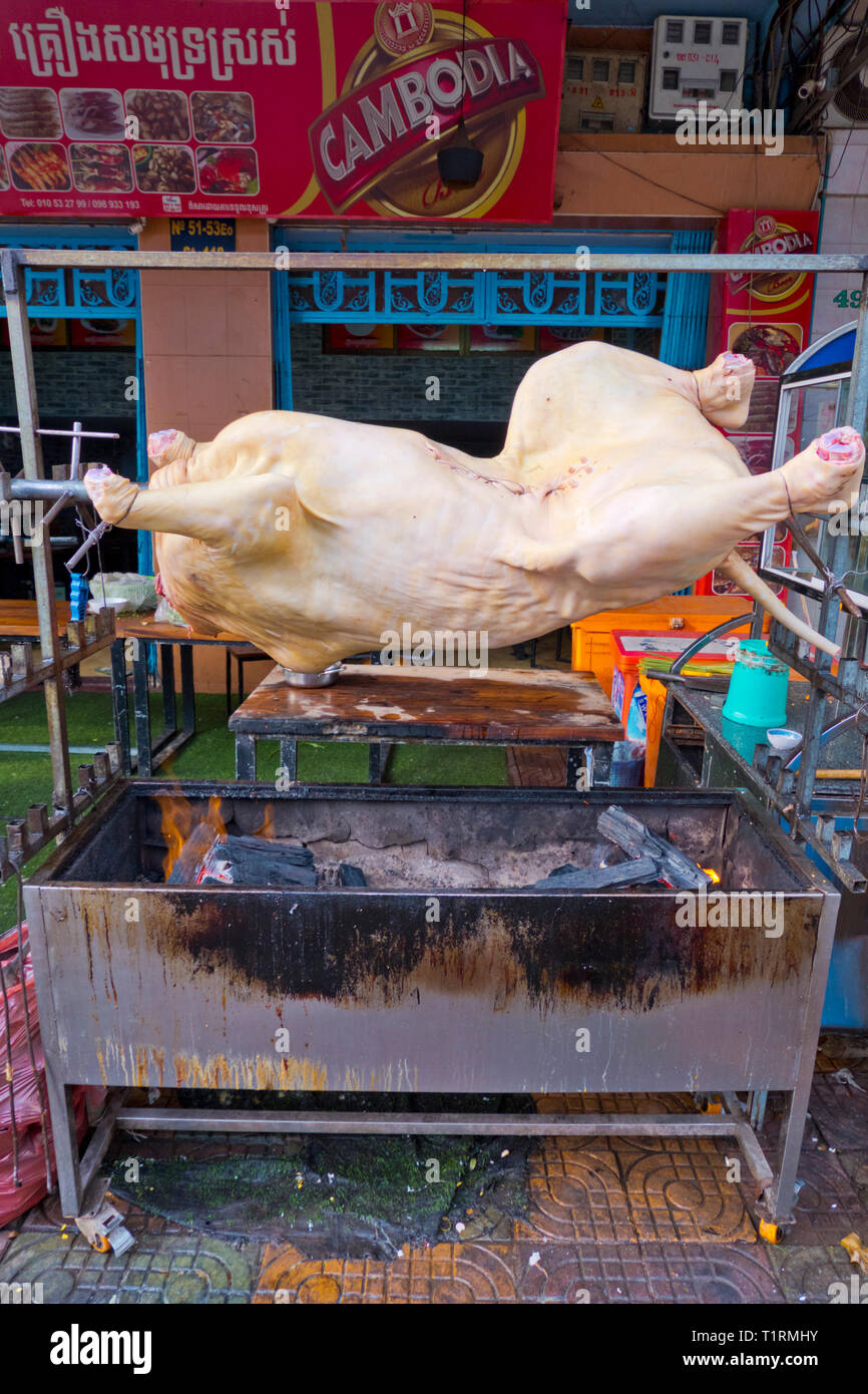 Whole cow being roasted, riverfront area, Phnom Penh, Cambodia, Asia ...