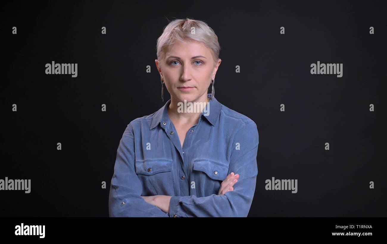 Woman with arms crossed over chest hi-res stock photography and images ...