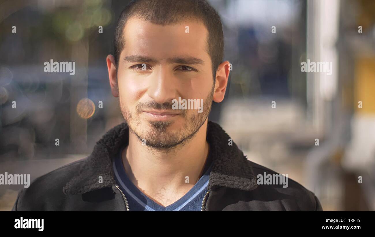 Serious brunette guy watching camera hi-res stock photography and ...