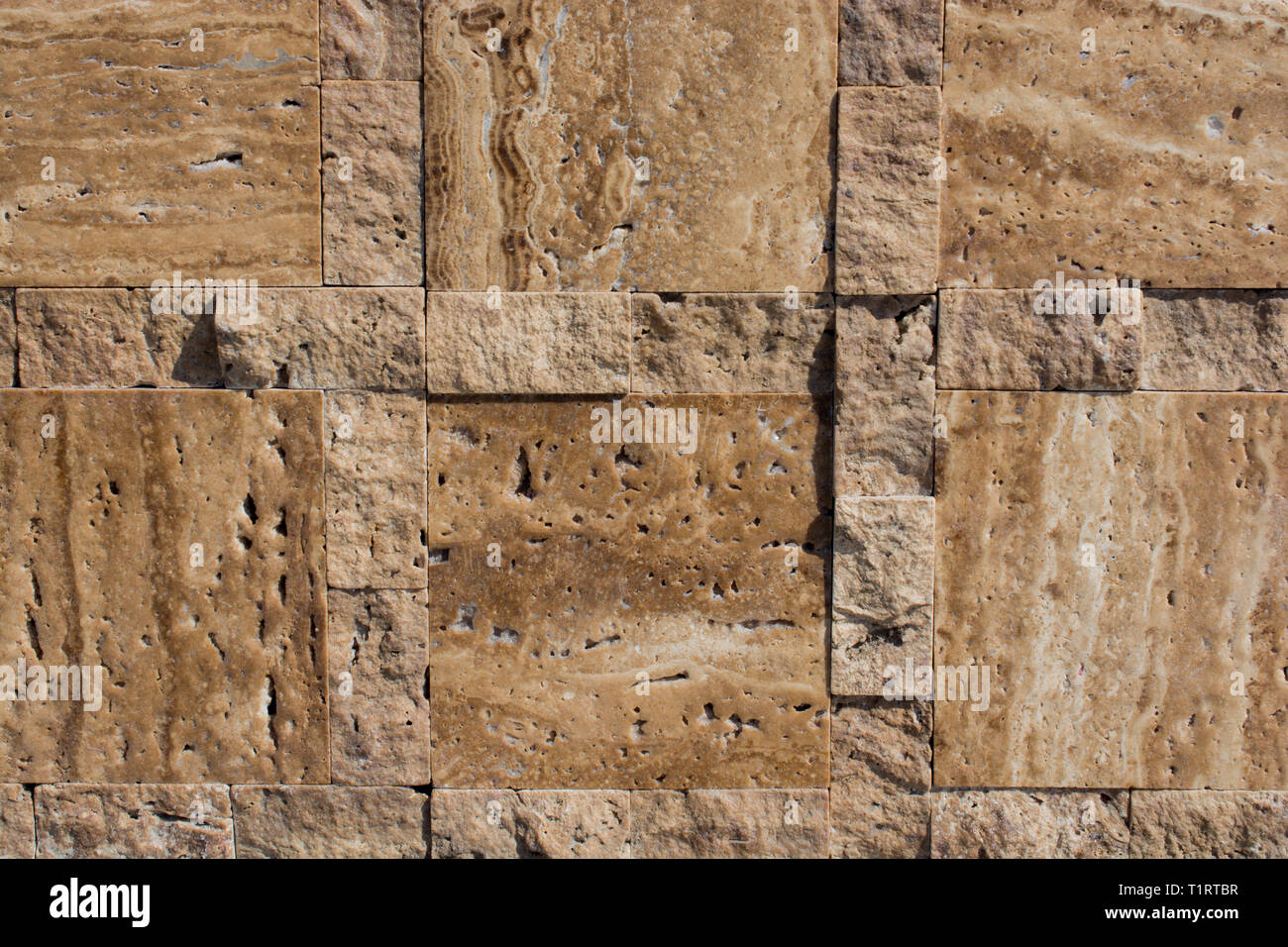 Decorative cubic stone wall as background texture Stock Photo - Alamy