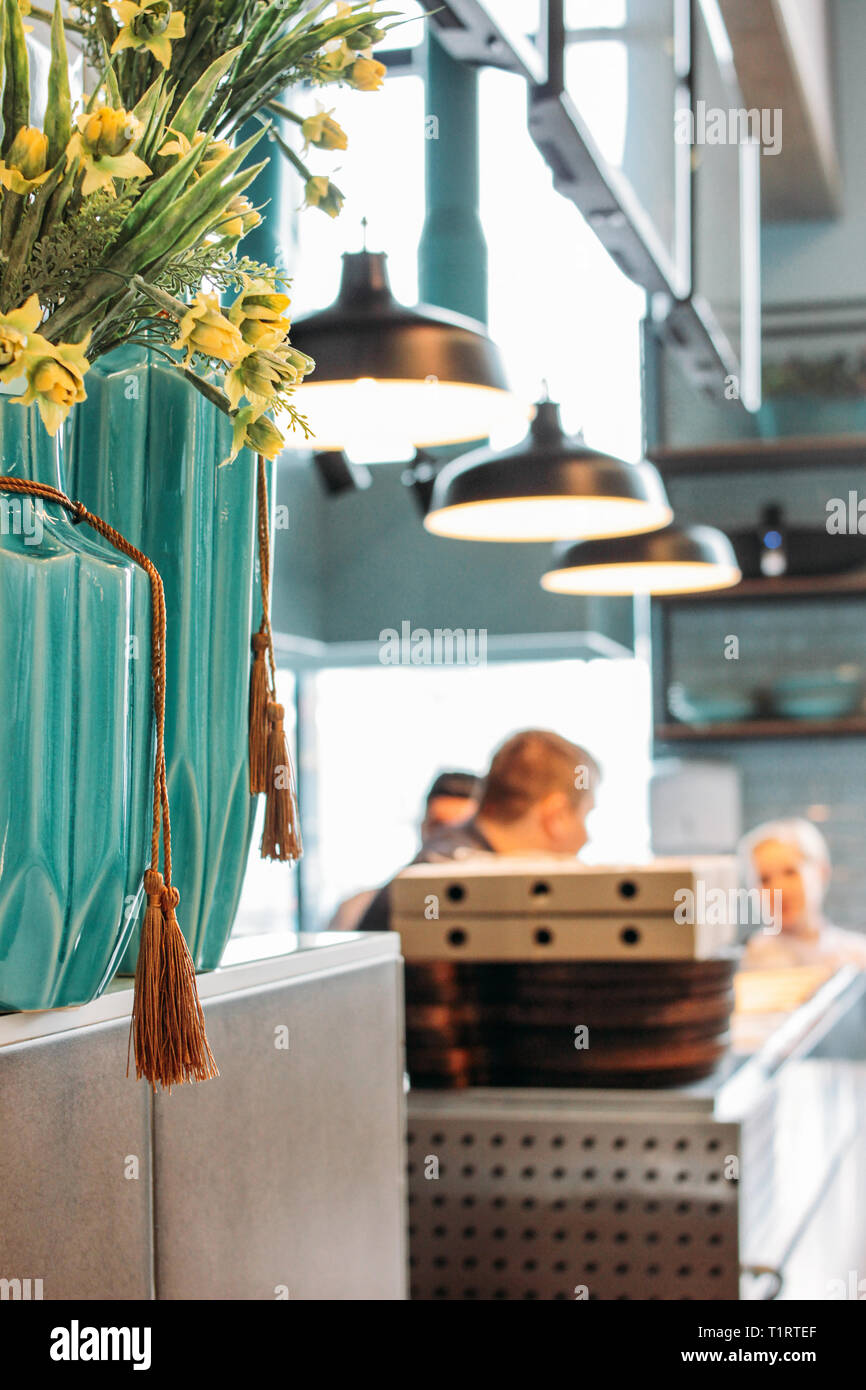 Modern light blue interior of the cafe. Working moments, lifestyle ...