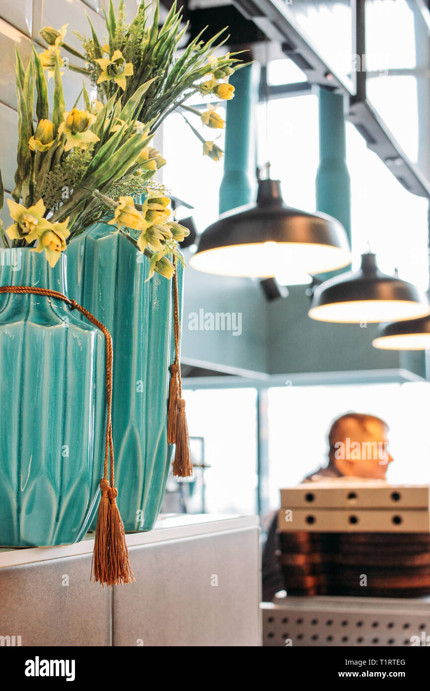 Modern light blue interior of the cafe. Working moments, lifestyle ...