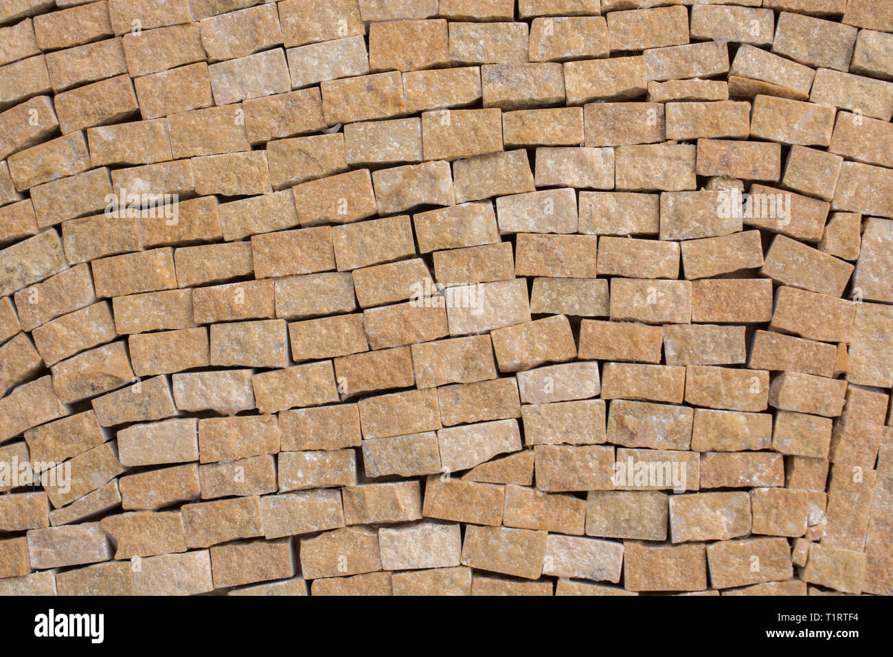Decorative cubic stone wall as background texture Stock Photo - Alamy