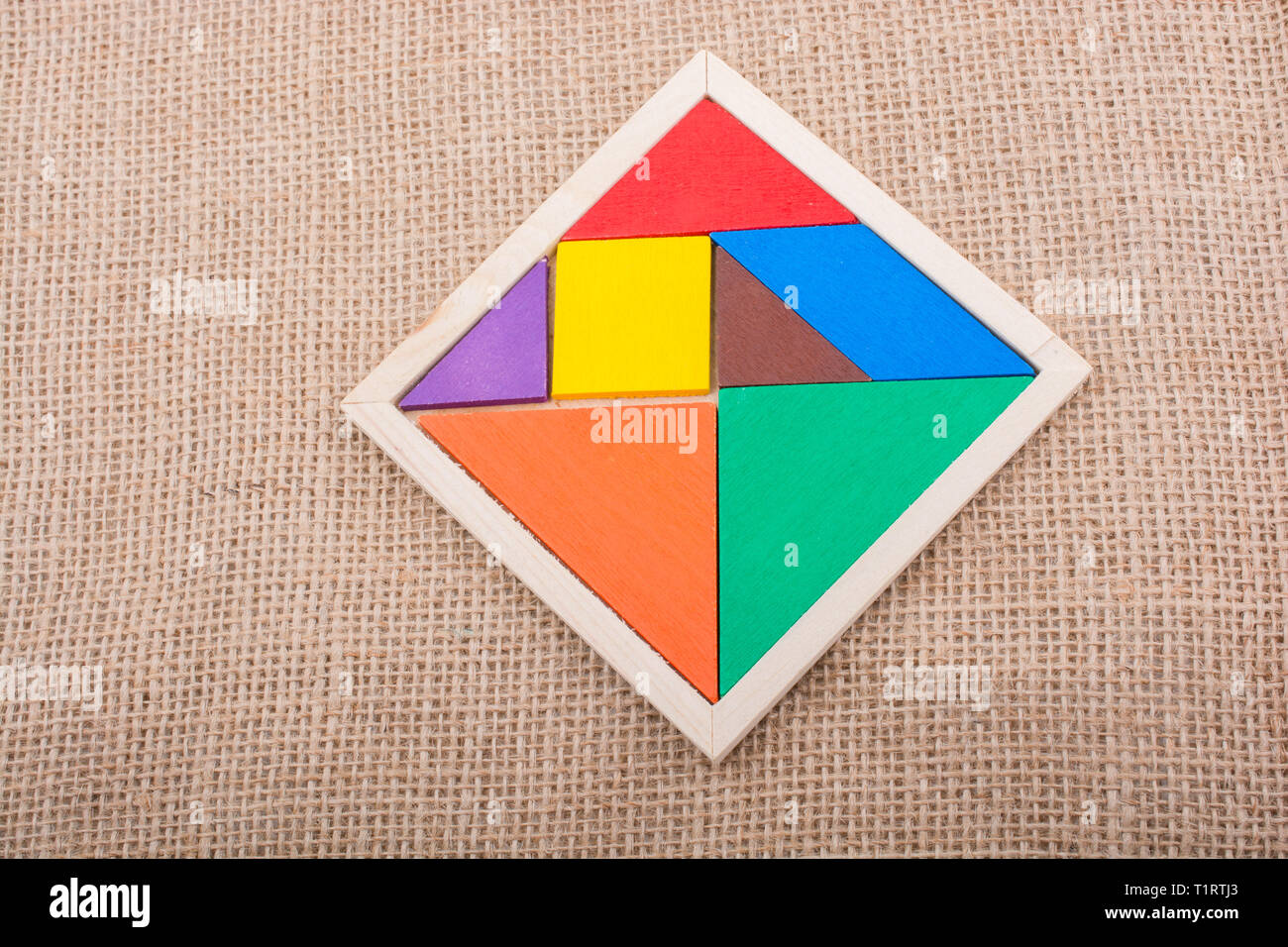 Colorful pieces of a square tangram puzzle Stock Photo - Alamy