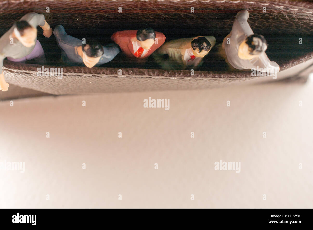 Tiny figurine of group of men miniature model in pockets Stock Photo ...