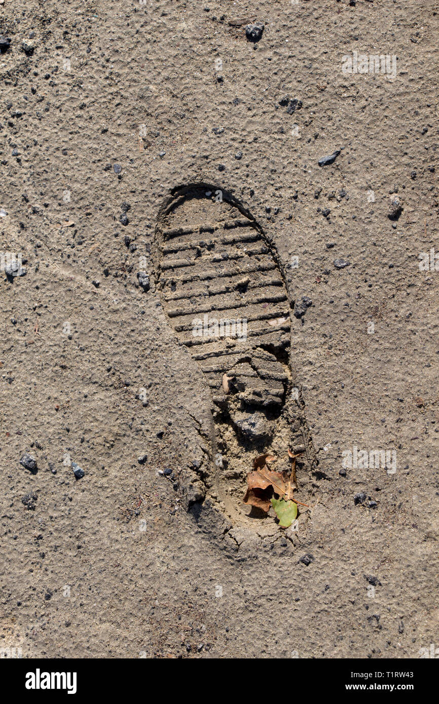 Footstep pattern seen on a concrete background Stock Photo - Alamy