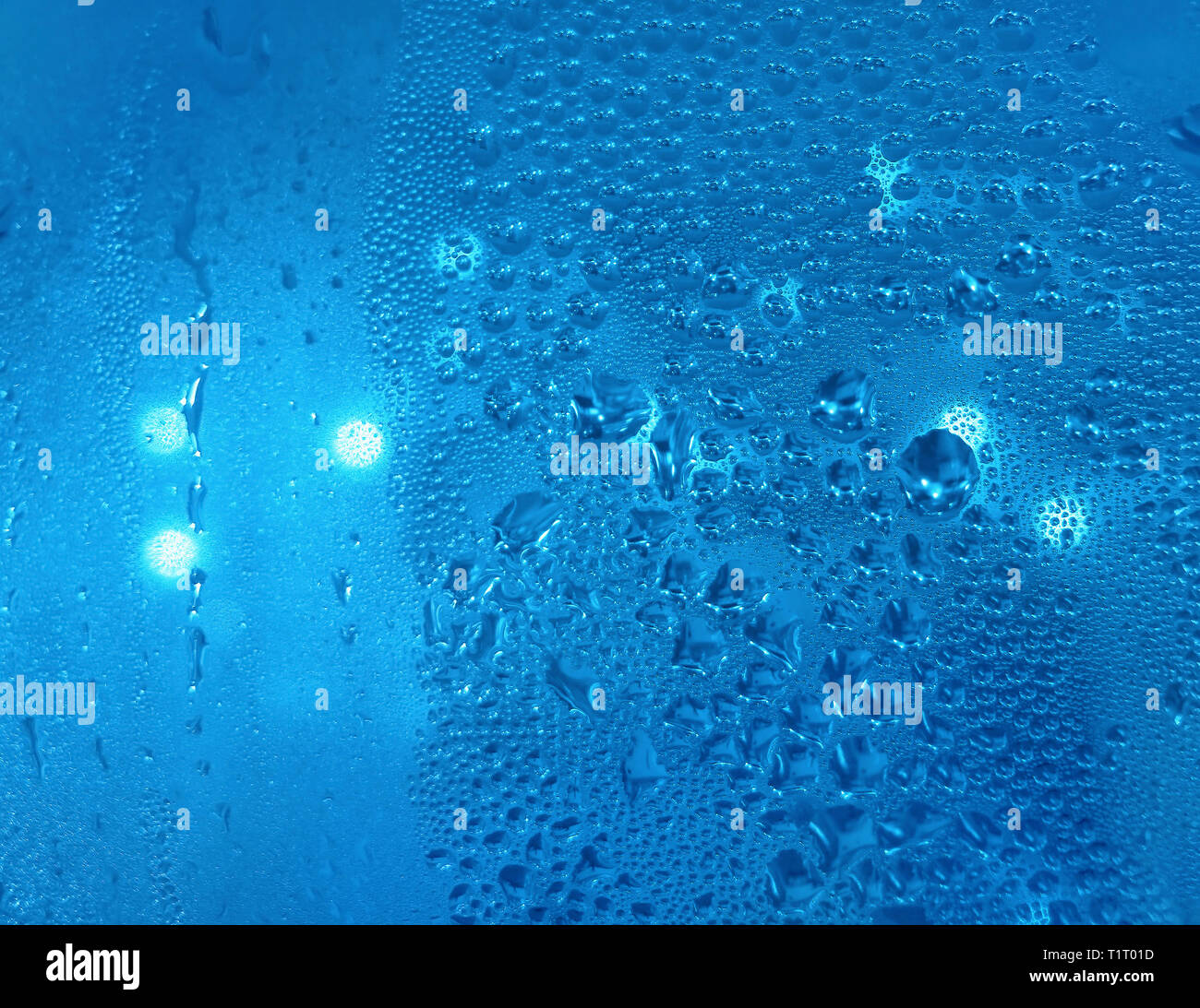 water drops and light at night window Stock Photo - Alamy