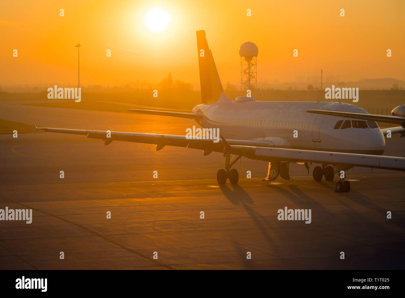Airplane about to take of from an air port. Aircraft wing at the ...