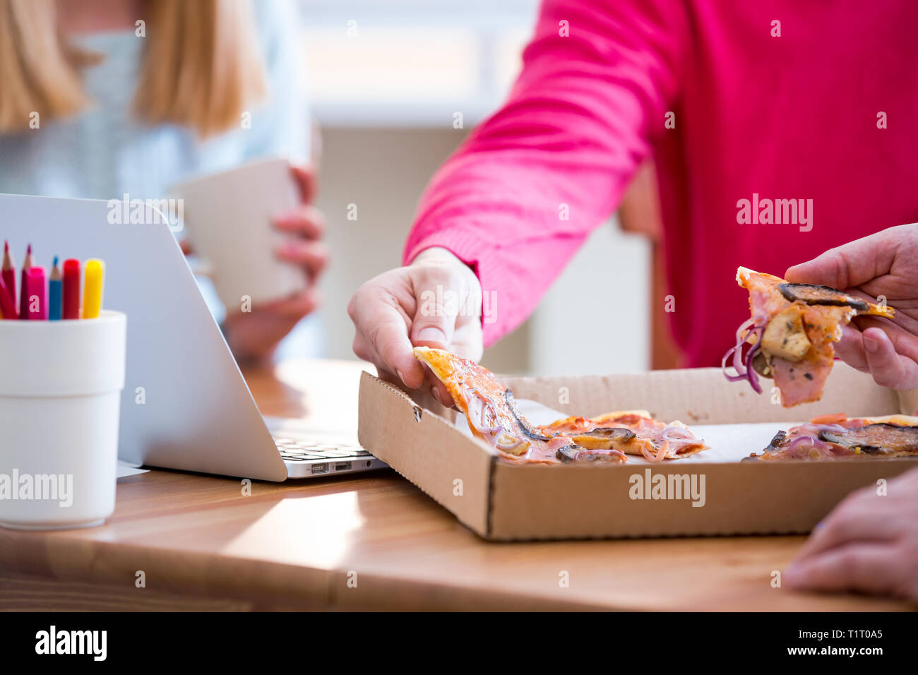 Snack happy co workers hi-res stock photography and images - Alamy