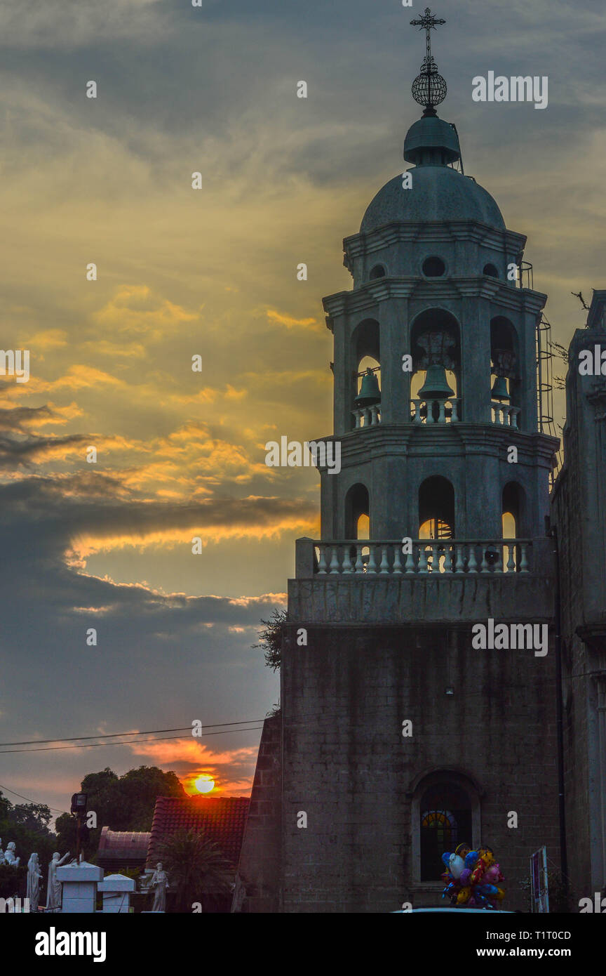 A sunset sky behind a church tower Stock Photo - Alamy
